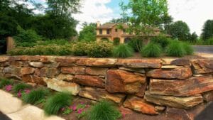 How to Build a Boulder Retaining Wall: Design Ideas, Materials & Costs ...