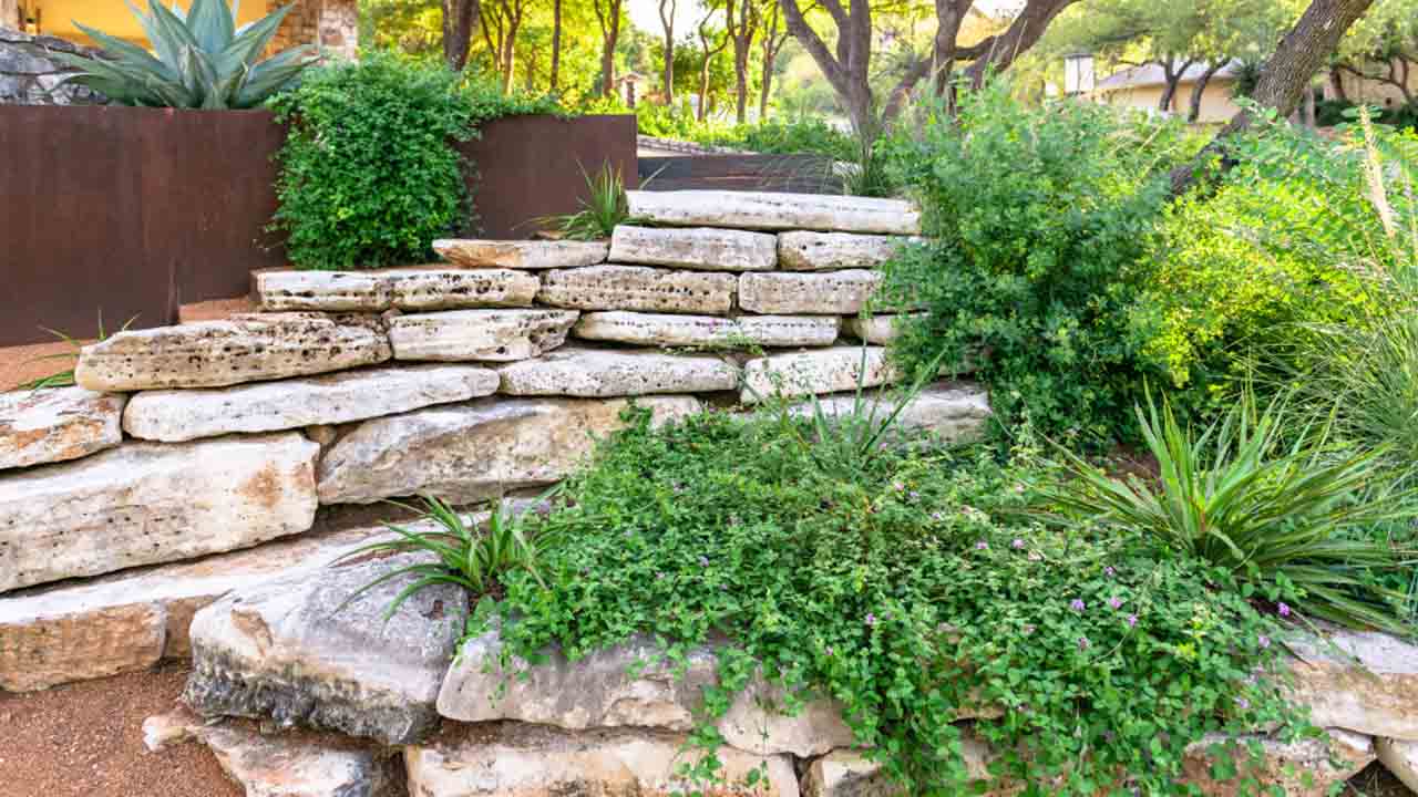 How to Build a Boulder Retaining Wall: Design Ideas, Materials & Costs ...